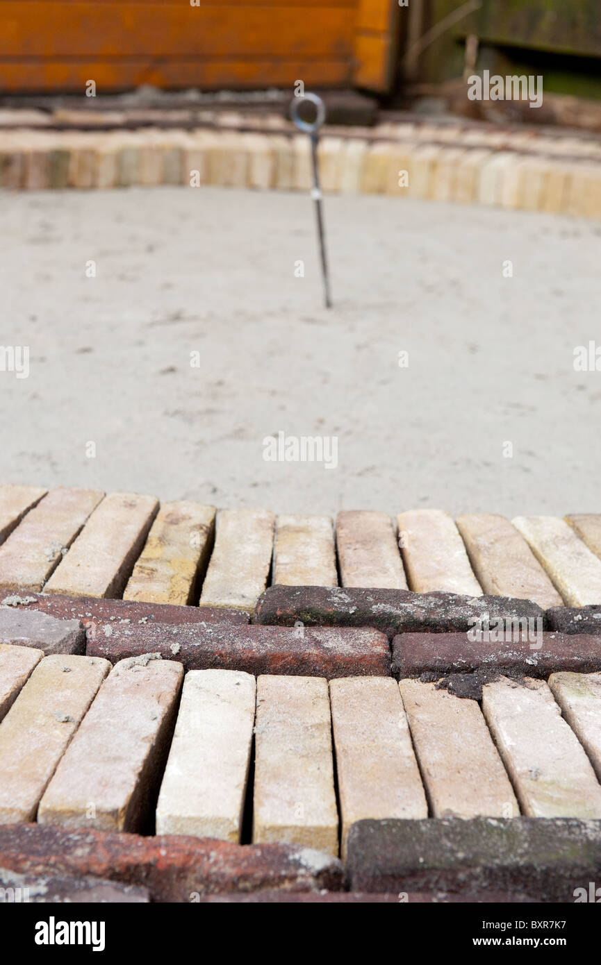 Making a new pavement circle in two colors Stock Photo - Alamy