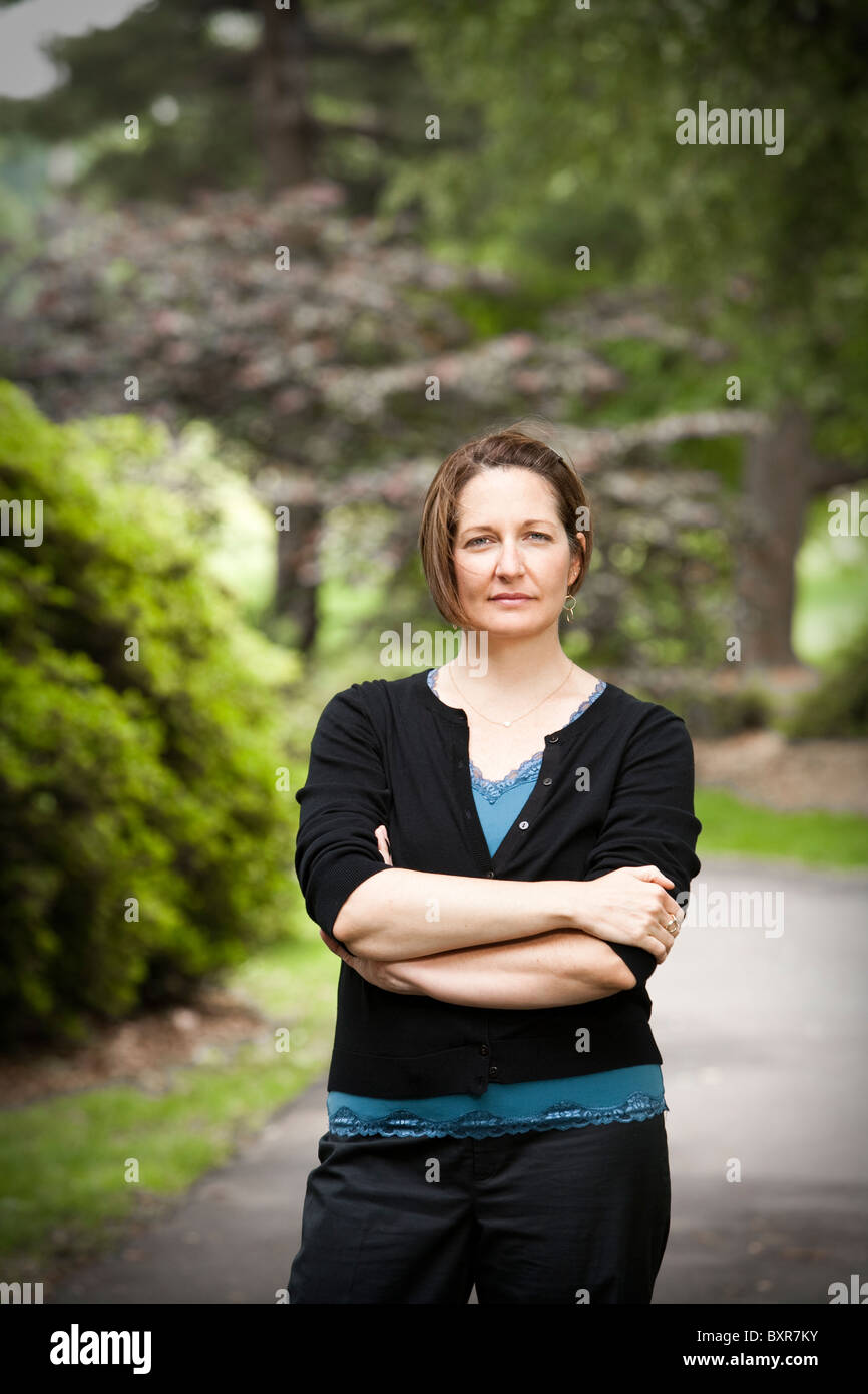 Portrait of woman in a park Stock Photo - Alamy