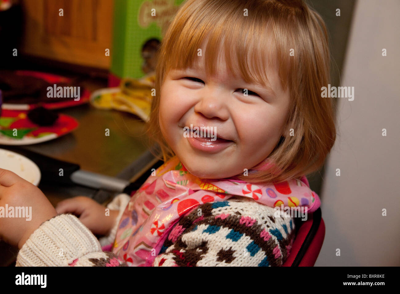 Portrait of a 20-month-old White girl smiling at the camera Stock Photo ...