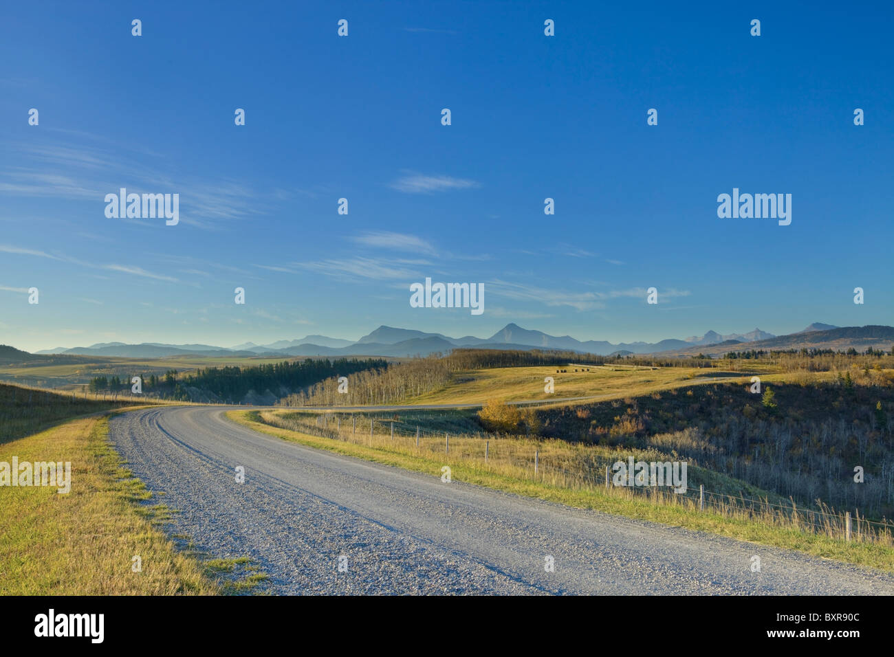 Backroad Running Towards Rocky Mountains, Alberta, Canada Stock Photo ...