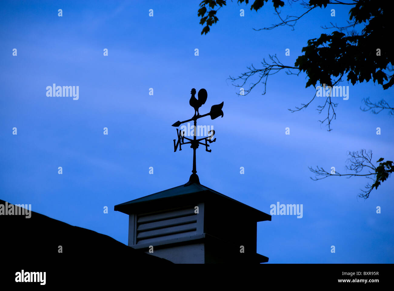 Weather wane on a dark and stormy sky Stock Photo - Alamy