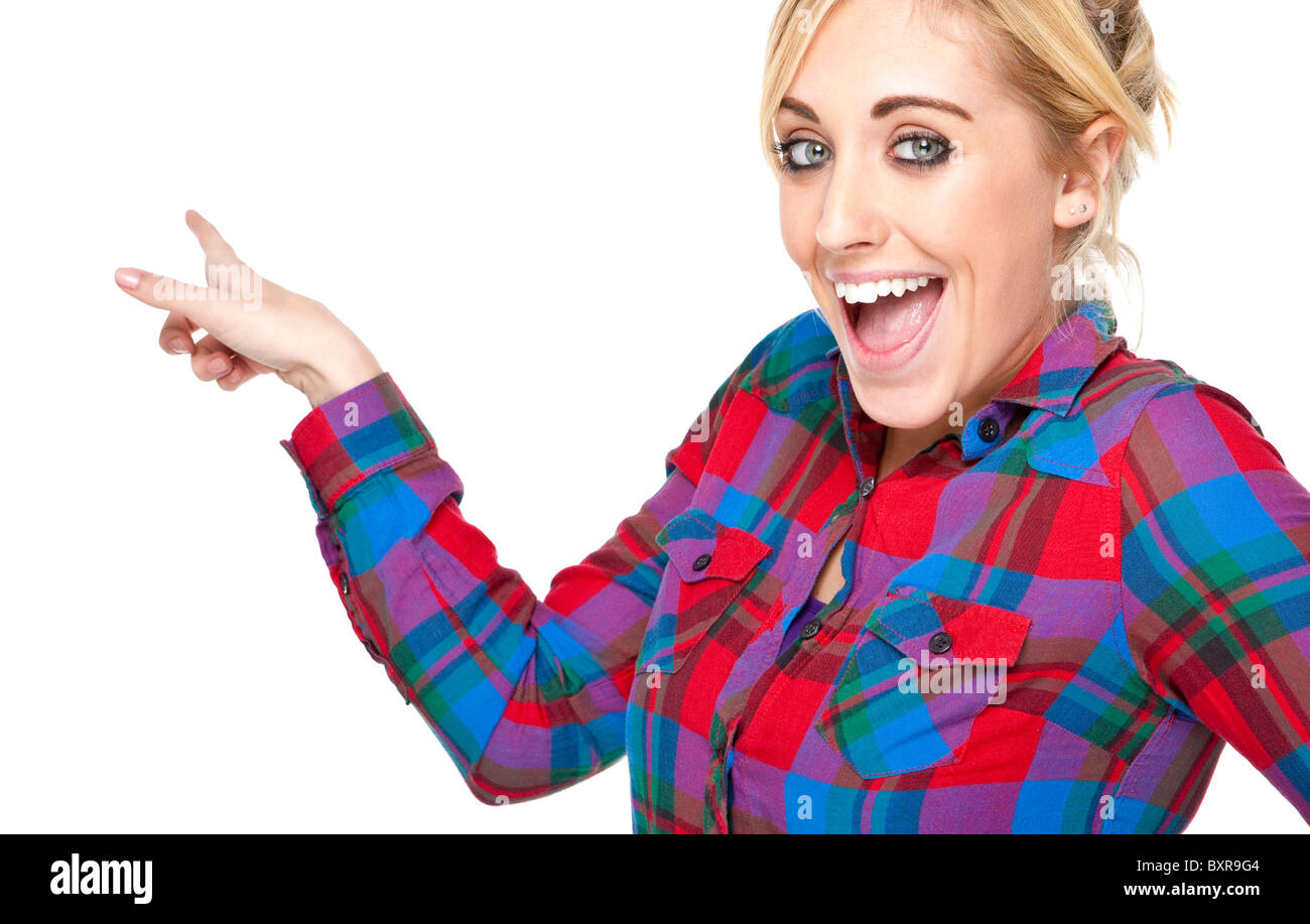Attractive Young Woman Pointing at Something Against White Background ...