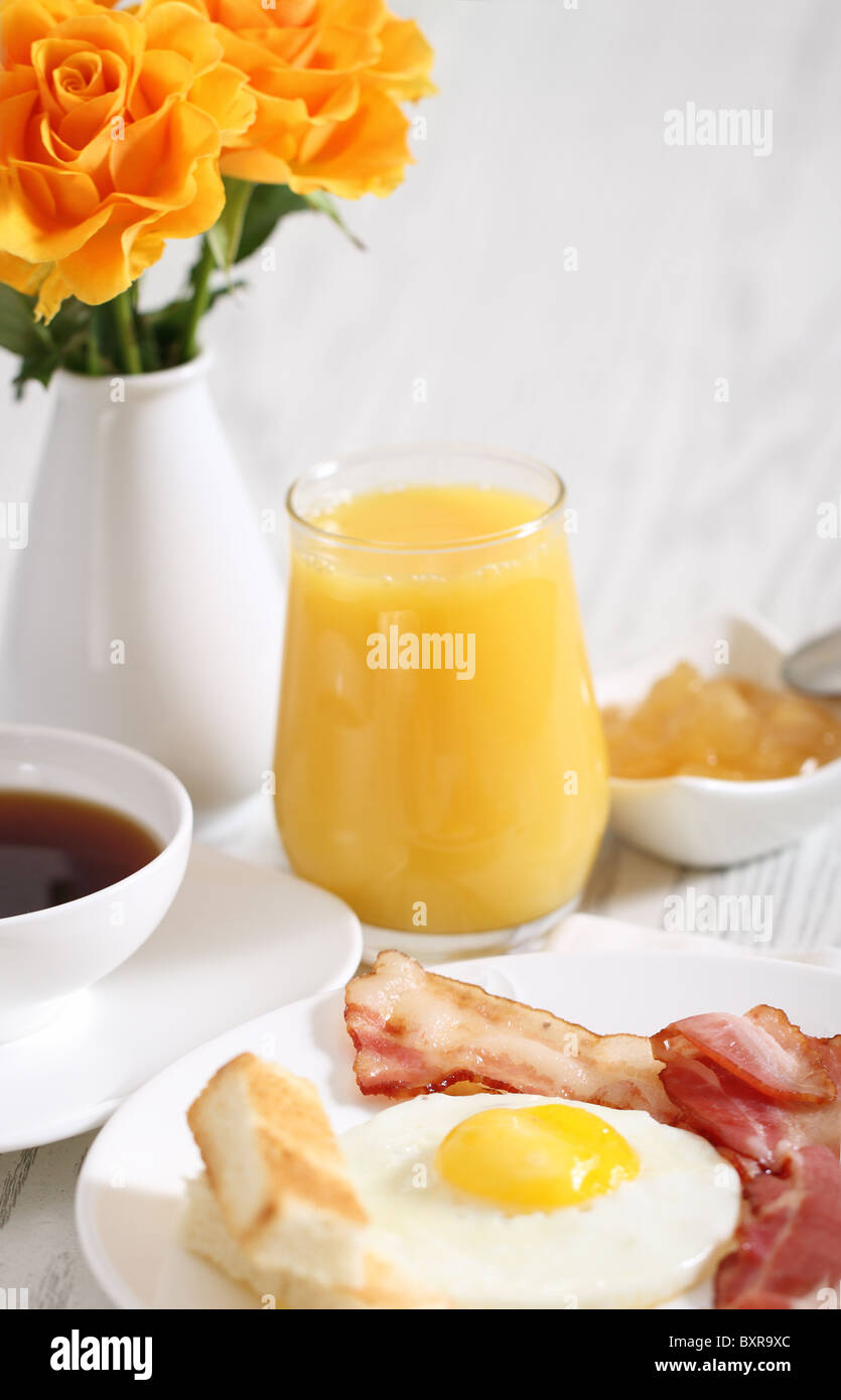 Tasty breakfast in the morning with roses Stock Photo - Alamy
