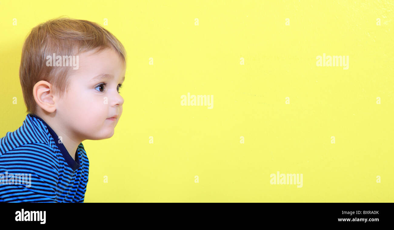 Cute caucasian toddler looking to the right. Extra text space on right ...