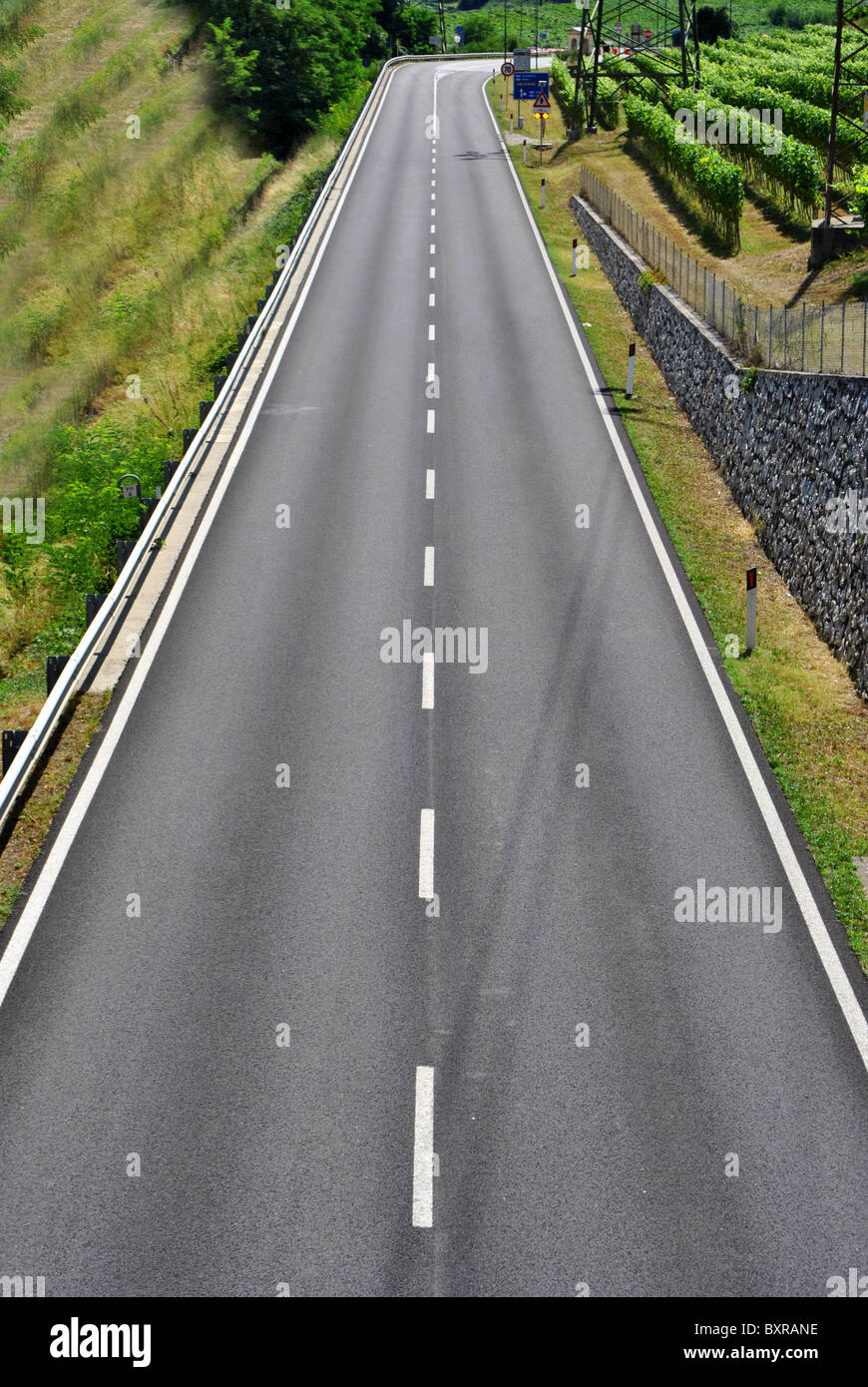 dual carriageway with white stripes and black asphalt Stock Photo - Alamy