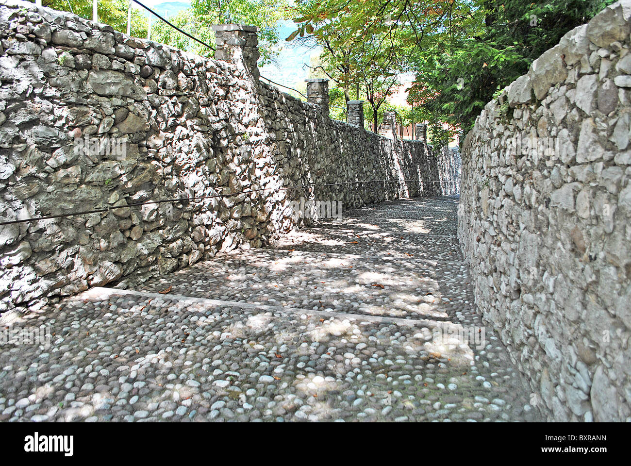road stones with high stone walls typical access to rural areas Stock ...