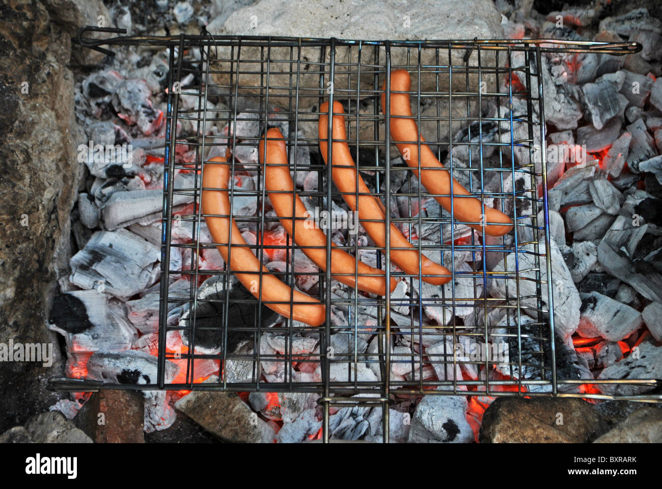 sausages cooking on hot coals Stock Photo - Alamy