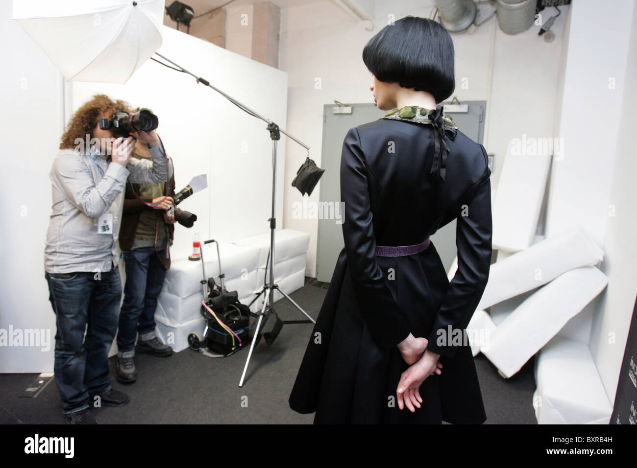 Model being photographed backstage before a fashion show Stock Photo ...