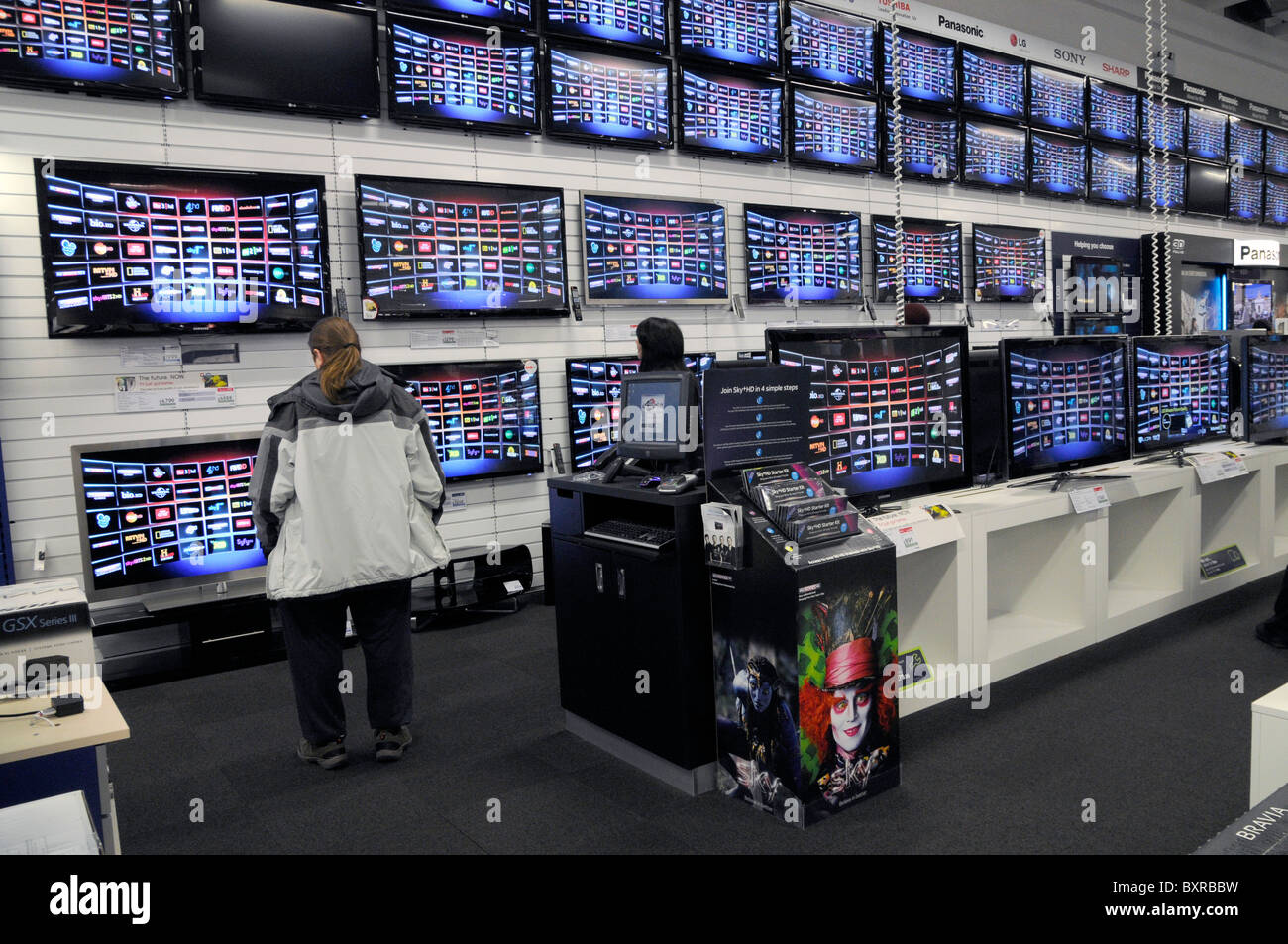UK. SHOPPERS CHOOSING NEW TV s AT ELECTRONIC CONSUMER GOODS DEPARTMENT ...