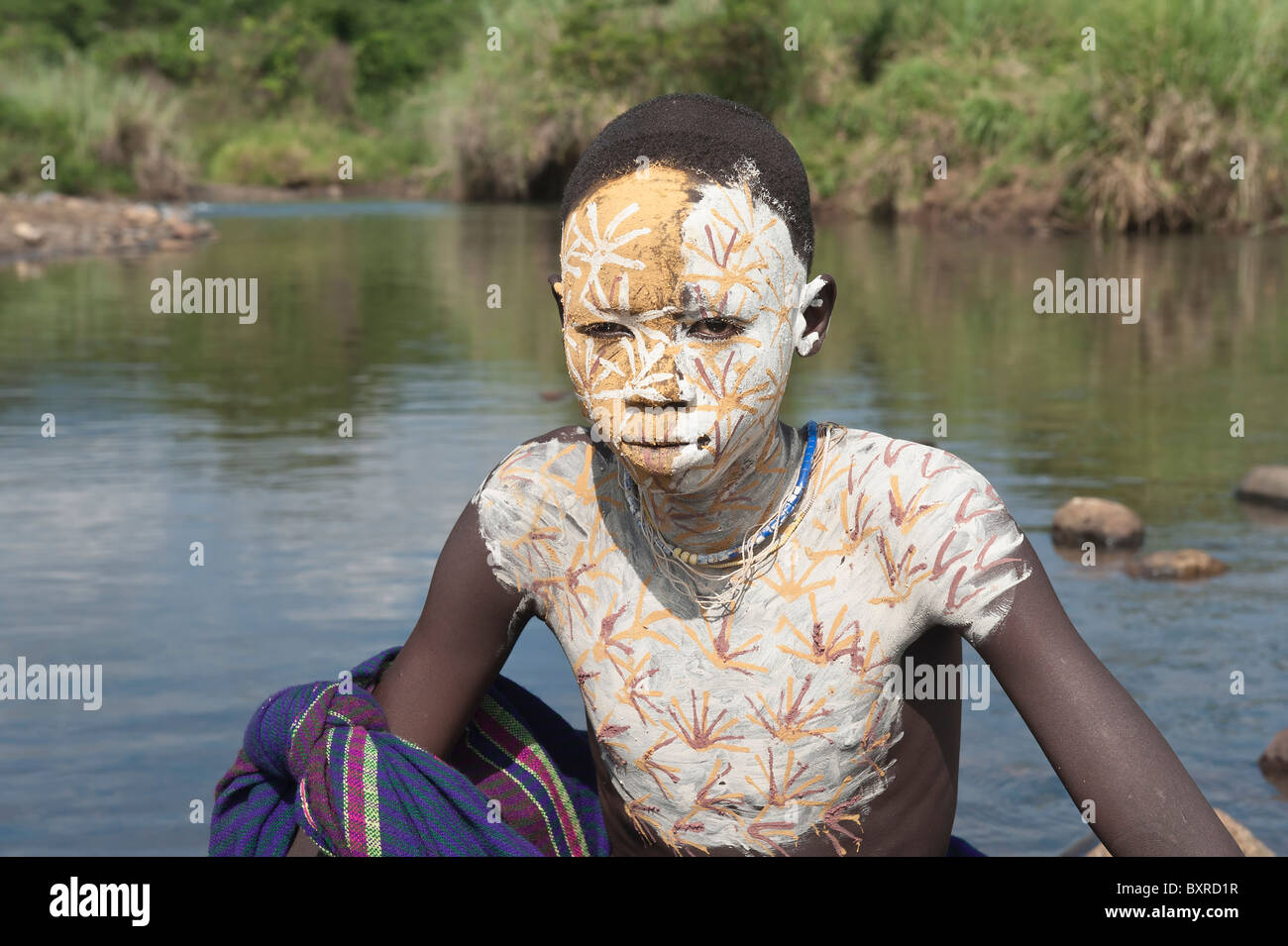 Surma boy in the river with body paintings, Kibish, Omo River Valley ...