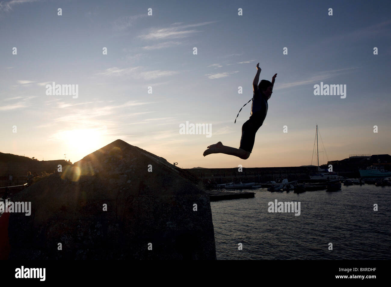 Pier jumping from the harbour wall st Mary's Isles of Scilly, uk Stock ...