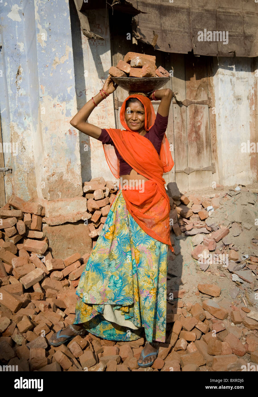 A female labourer carrying bricks in India Stock Photo - Alamy