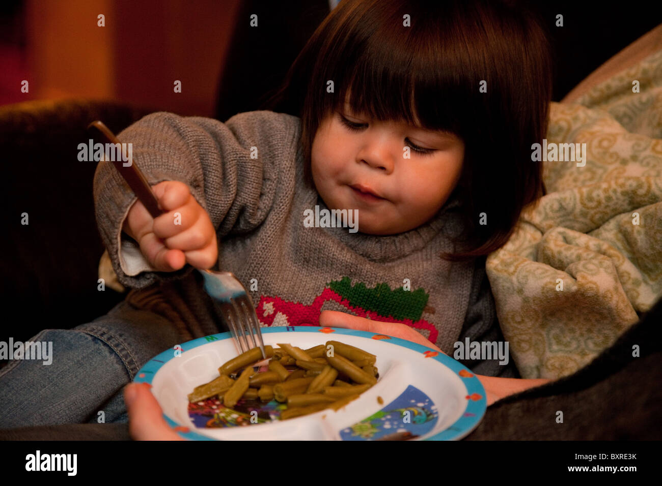 2-year-old Filipino/White boy eats green beans with a fork Stock Photo ...