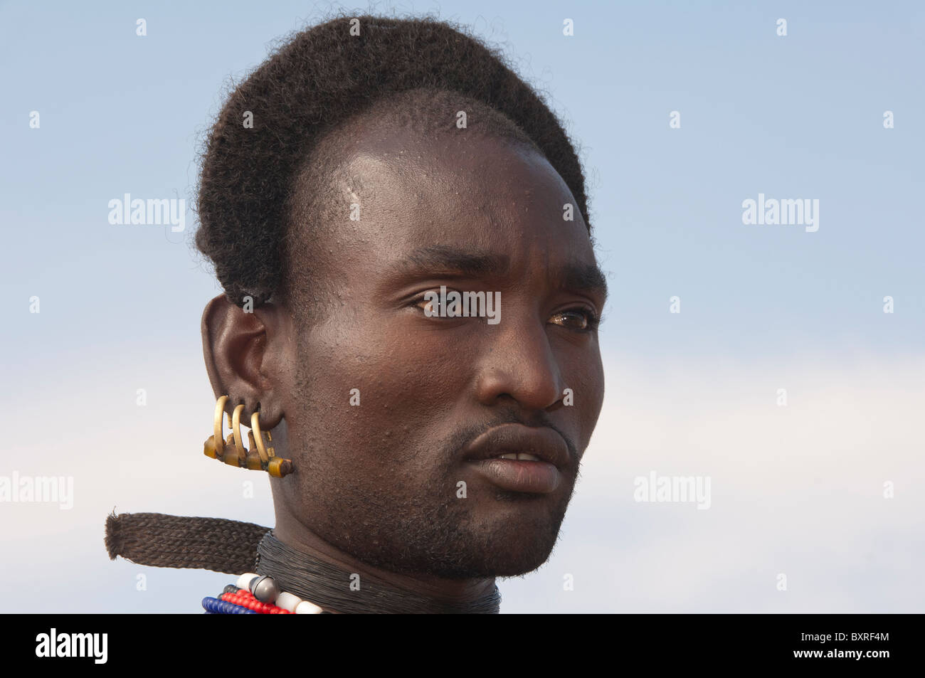 Portrait of a Hamar man with earrings and necklaces, Omo river valley ...