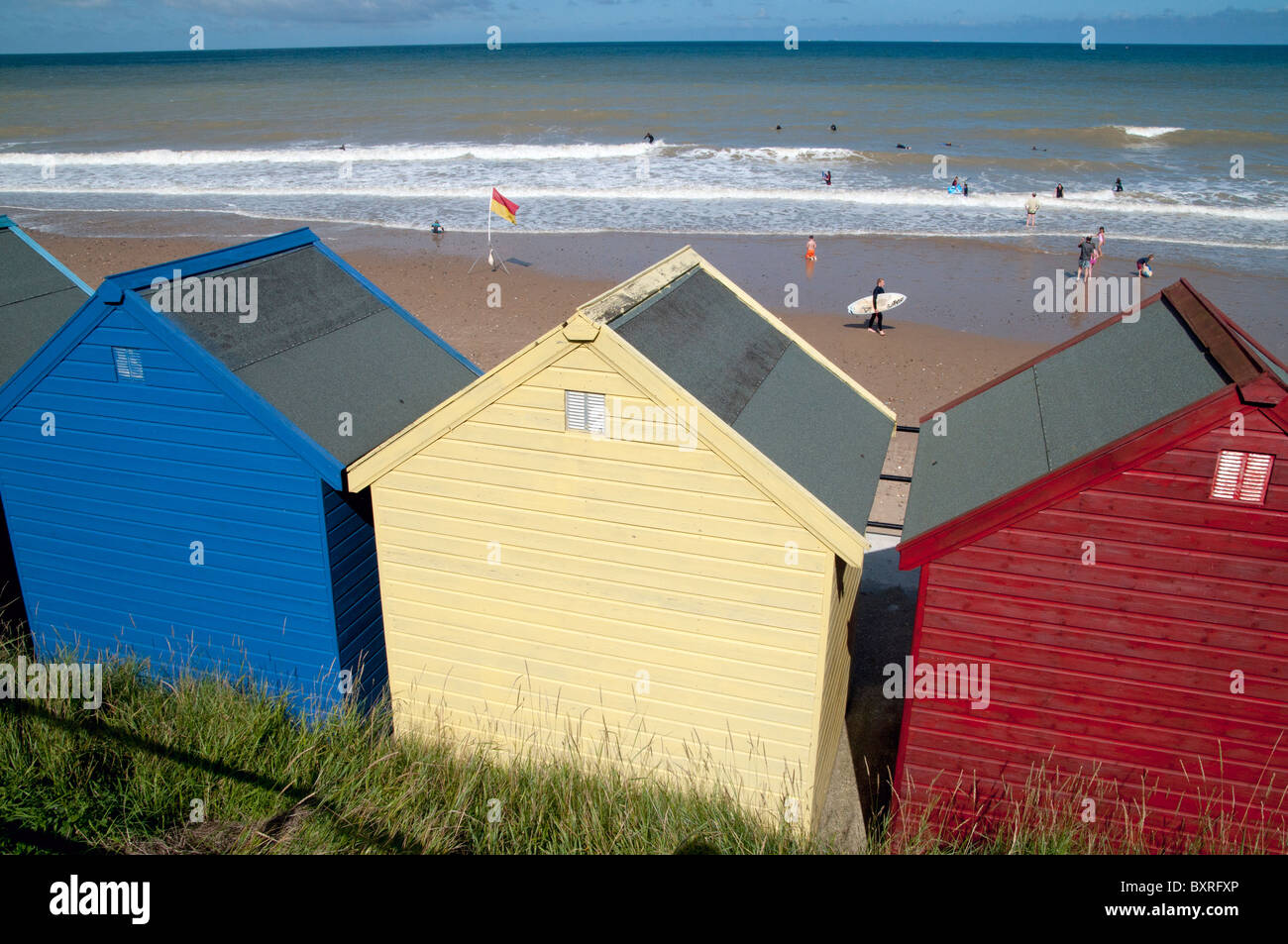 UK, beach huts and surfers in Mundesley beach,Norfolk,England,UK Stock ...
