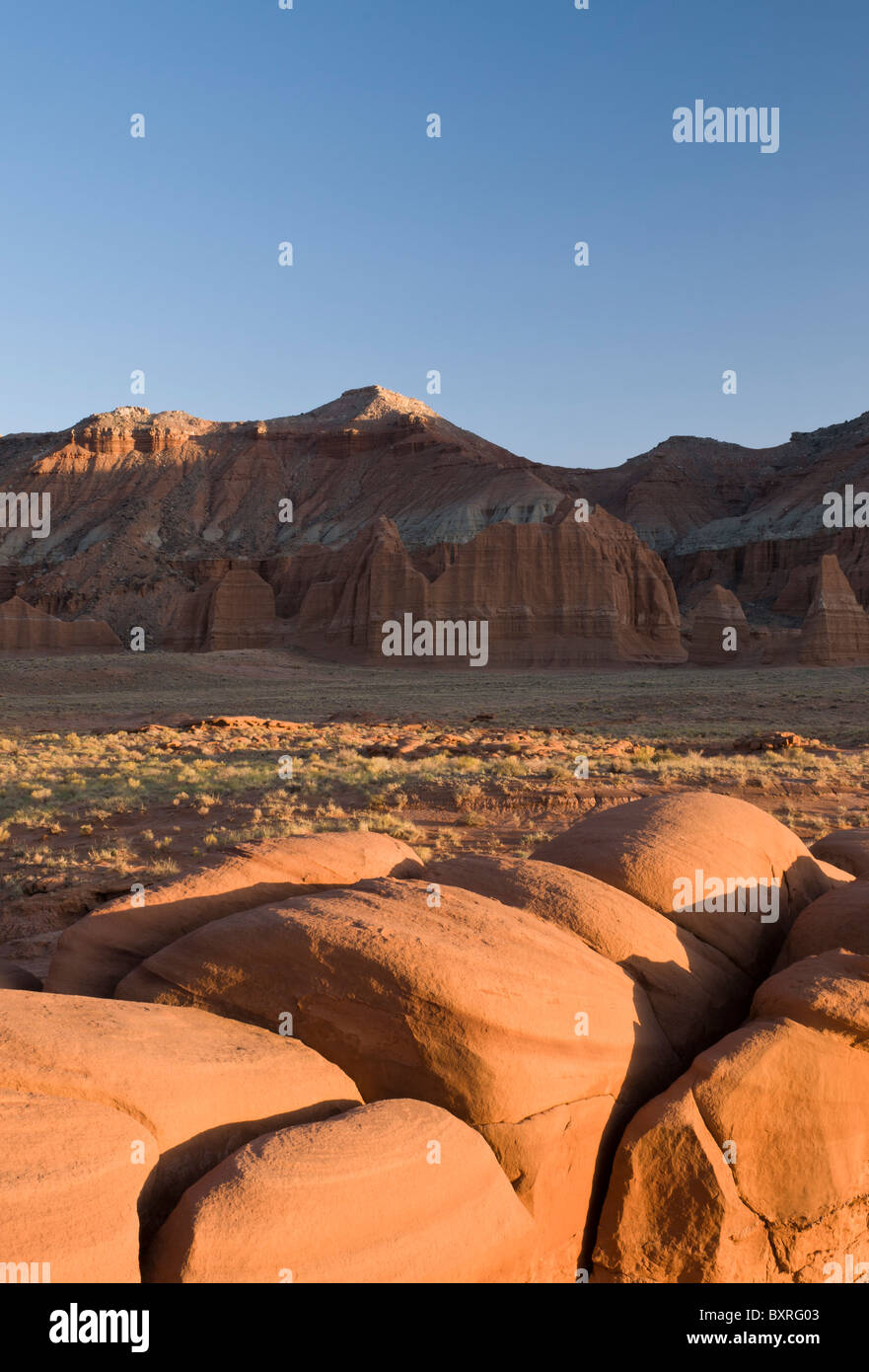 Red sandstone formations in Cathedral Valley at sunset near Temple of ...