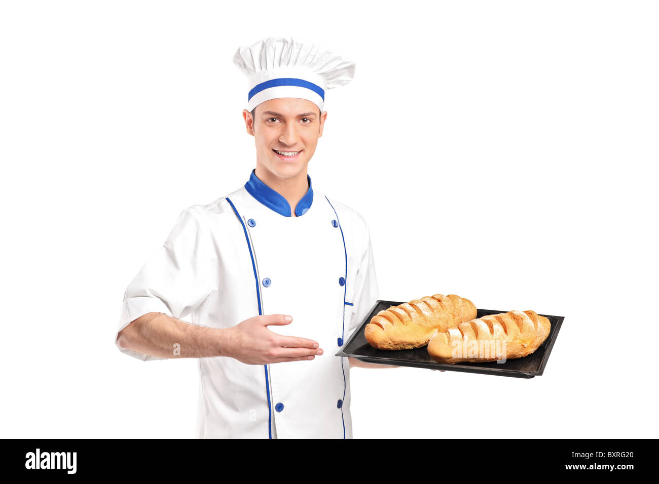 Smiling baker showing freshly baked breads Stock Photo - Alamy