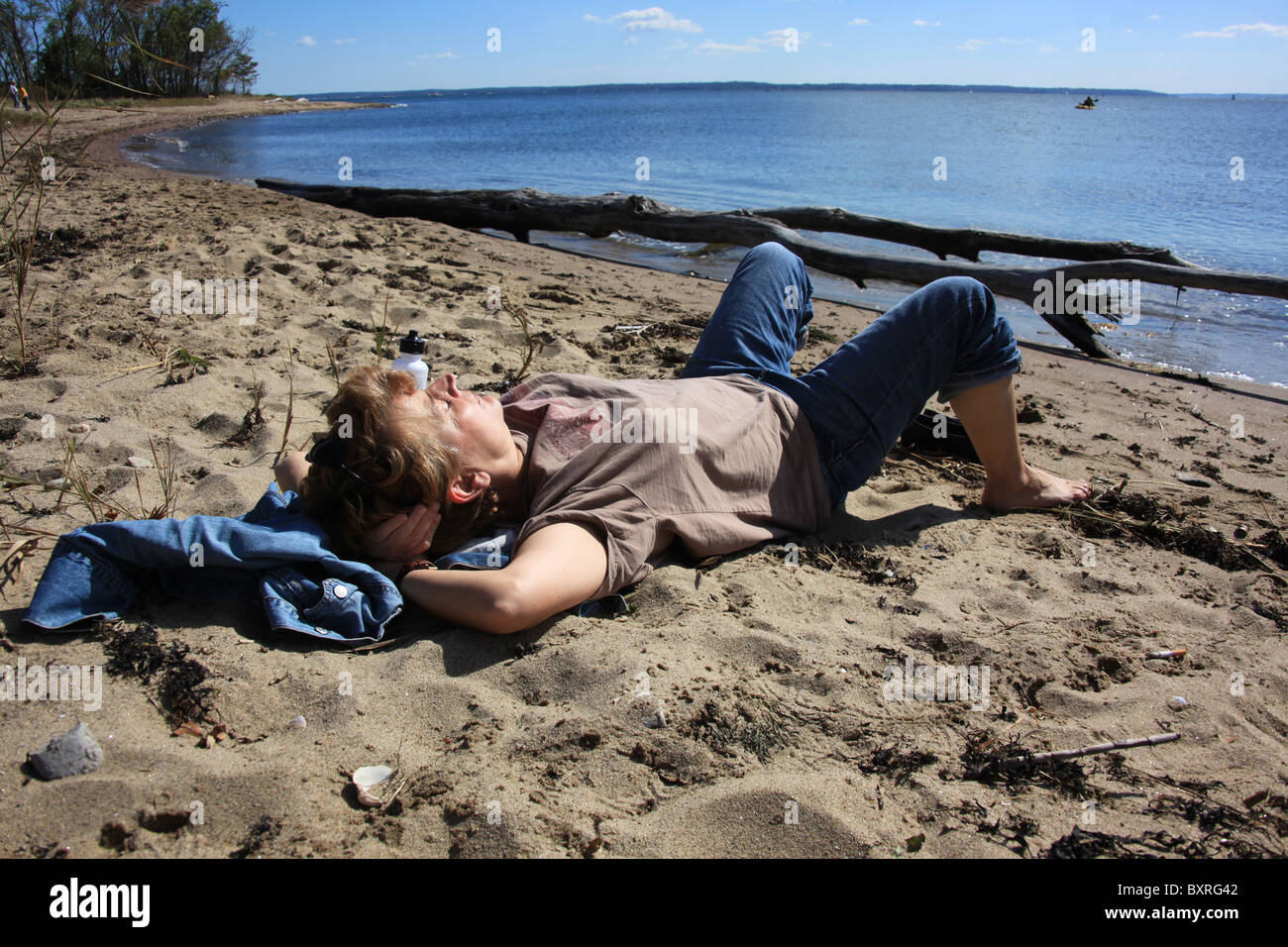 Woman beach taking beach sun tanning hi-res stock photography and ...