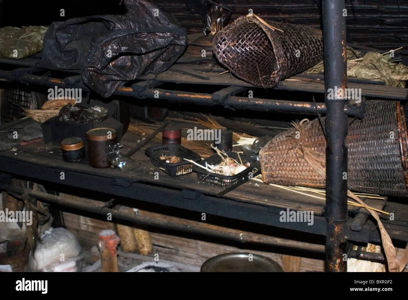 Baskets for gathering food and other items are on a kitchen shelf in a ...