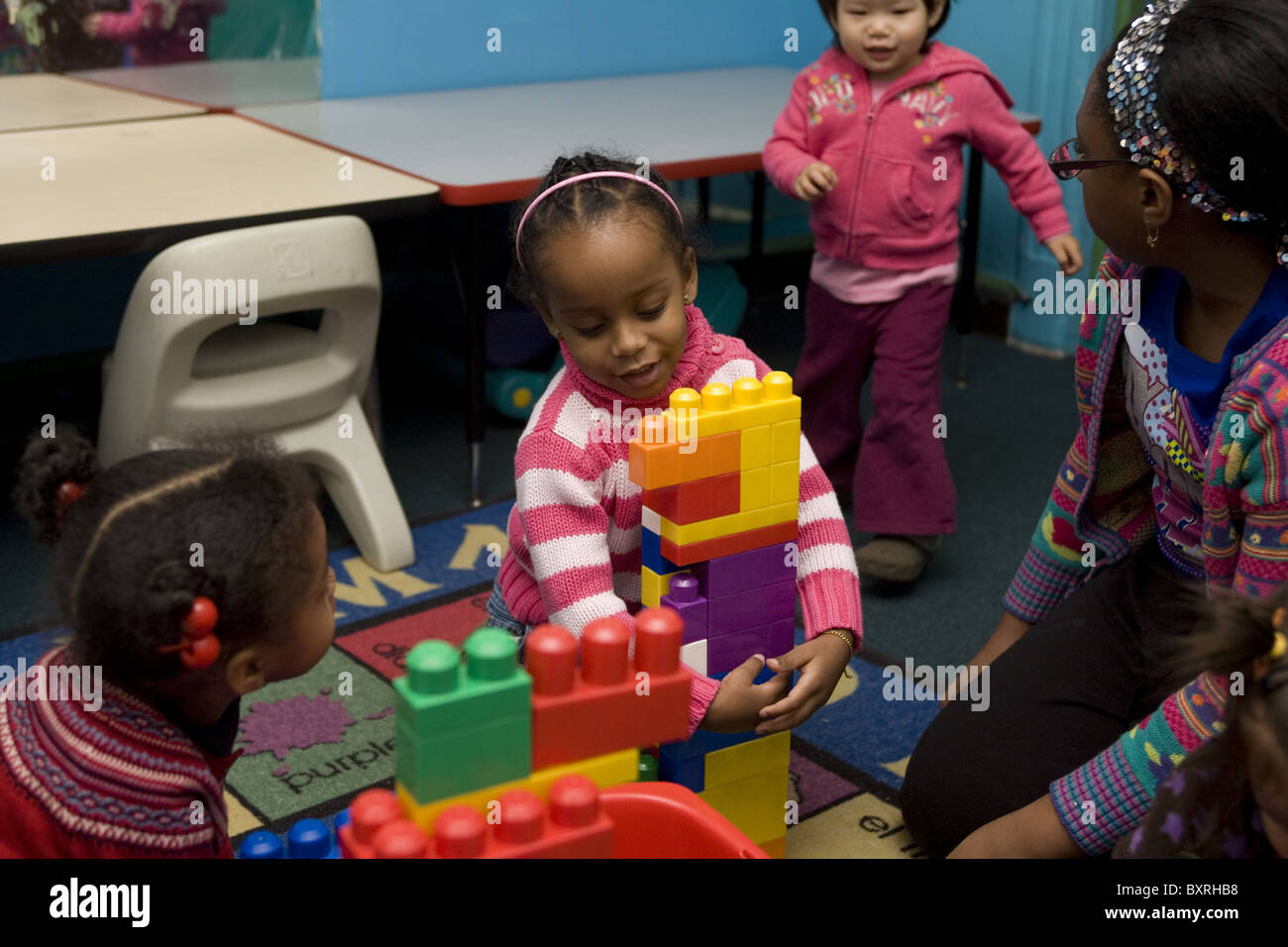 Diverse children playing in classroom hi-res stock photography and ...