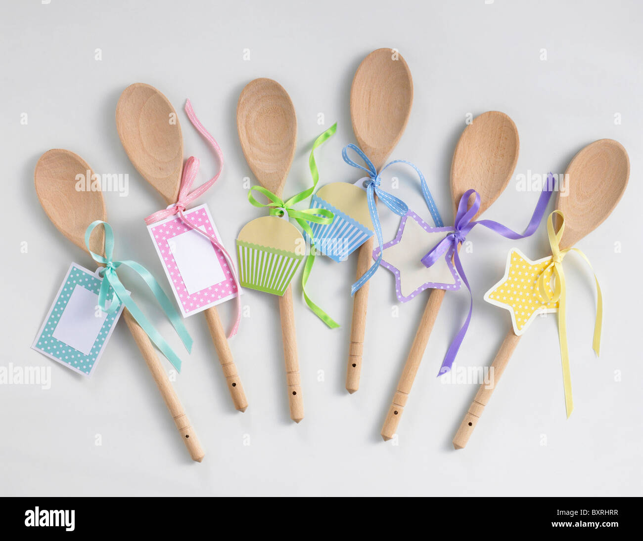 Cooking spoons with coloured tags tied around them, close-up Stock ...