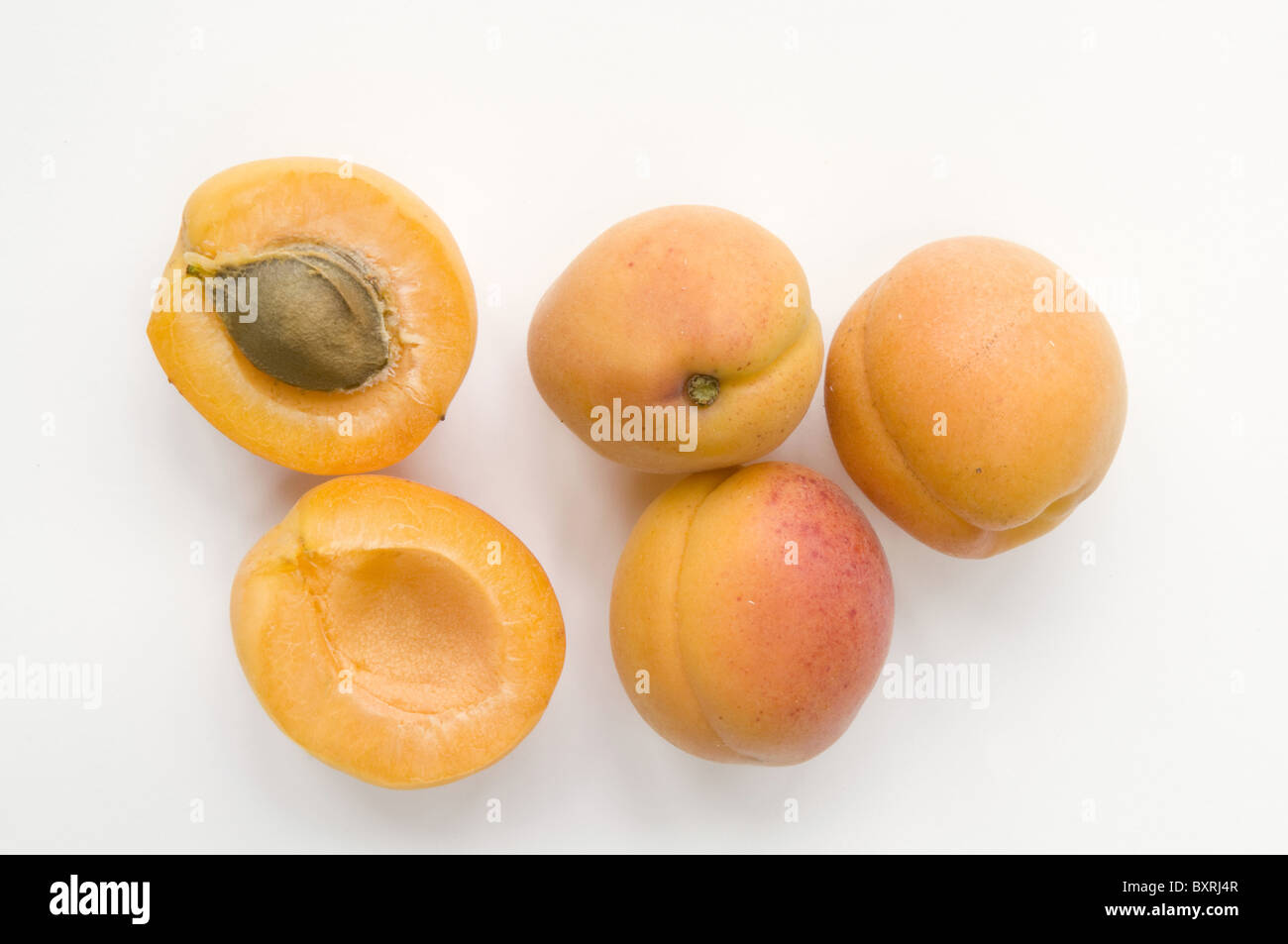 Apricot whole and halved Stock Photo - Alamy