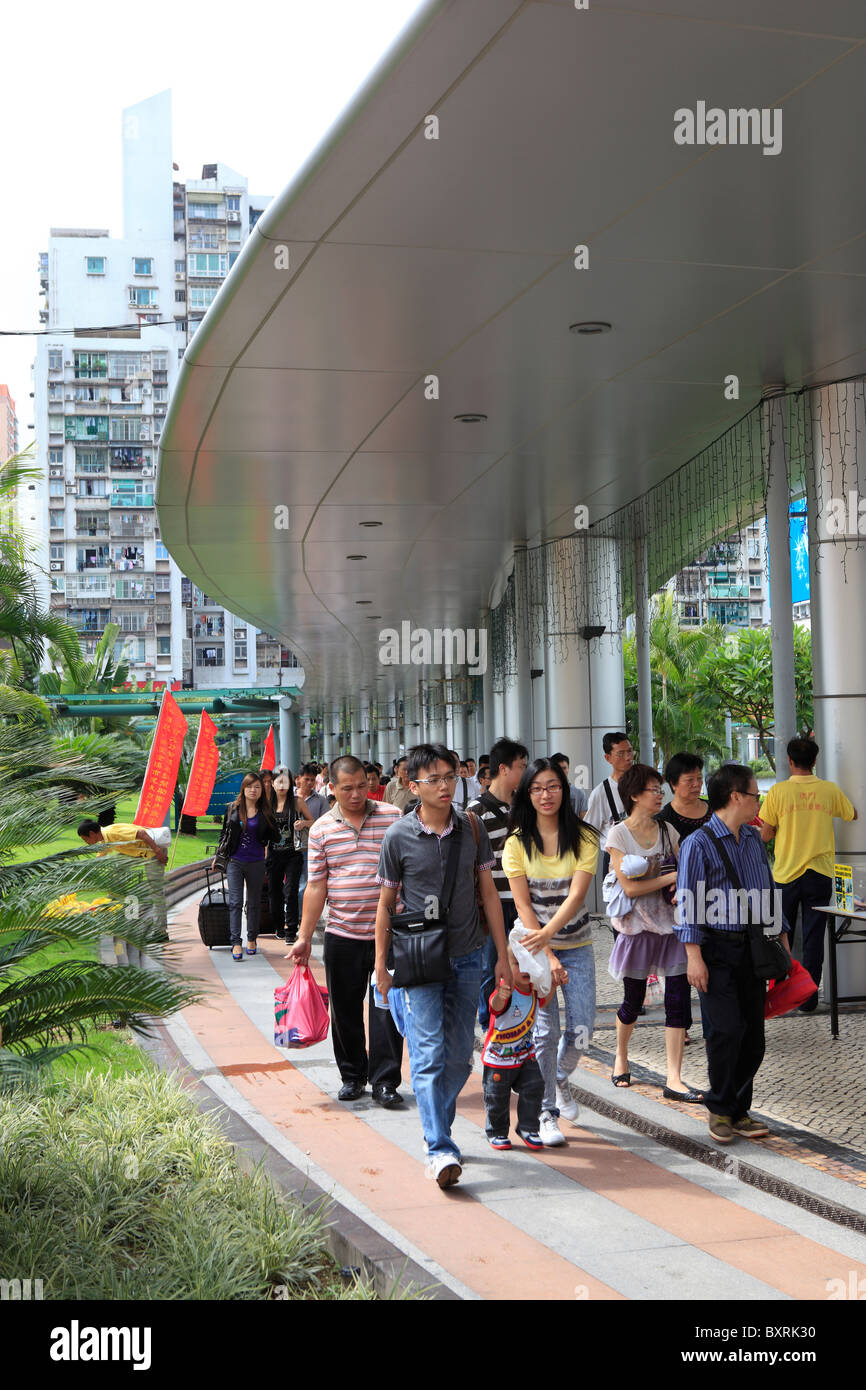 Thousands of people pass over the Macau/Chinese border, on a daily ...