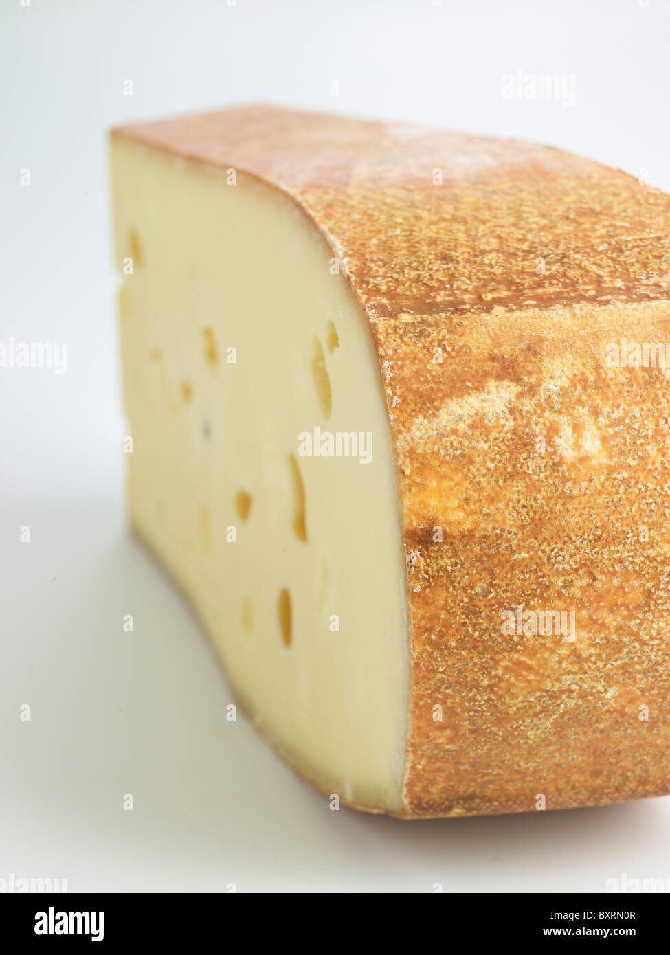 Emmental cheese against white background, close-up Stock Photo - Alamy