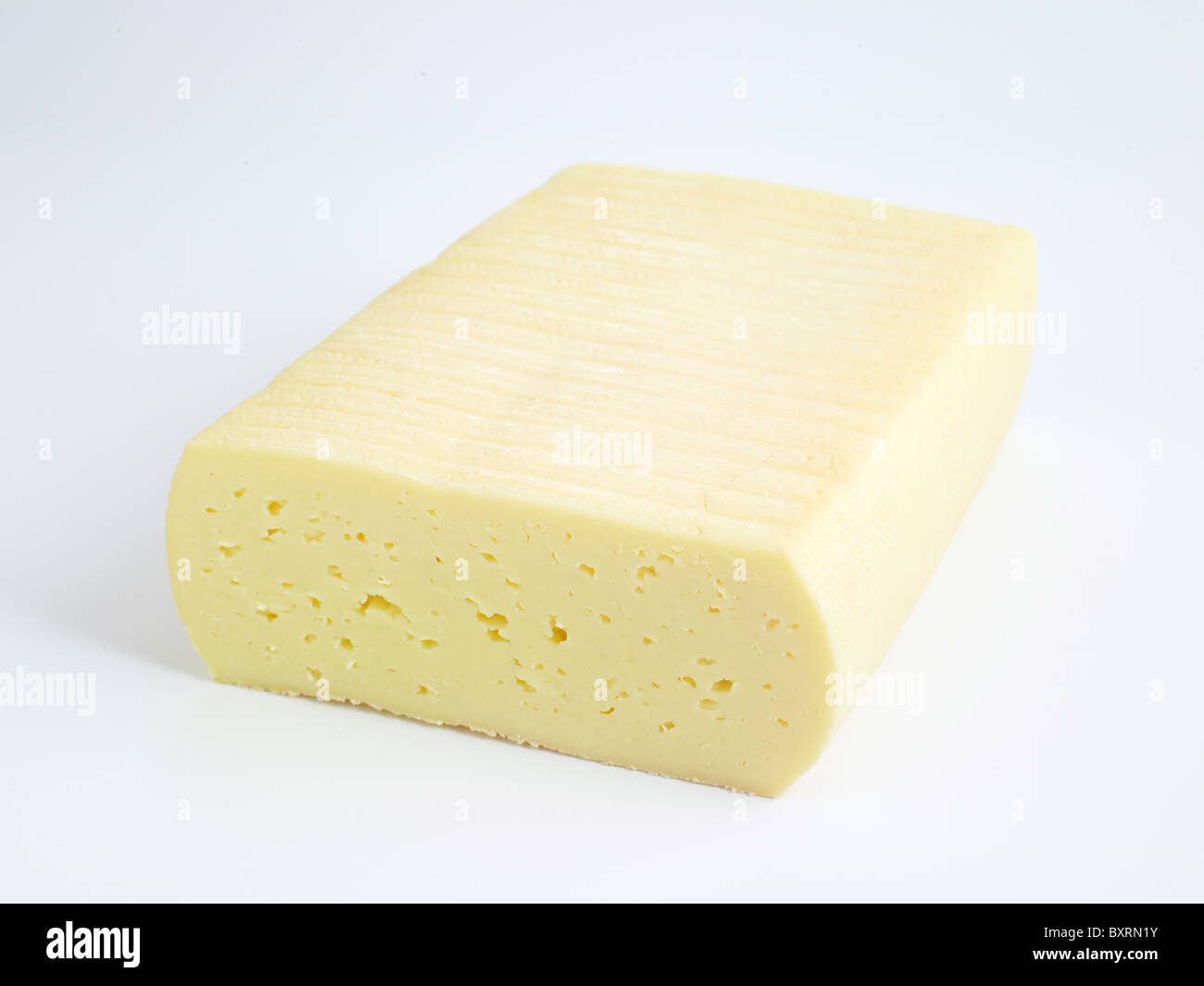 Danish Esrom cheese against white background Stock Photo - Alamy