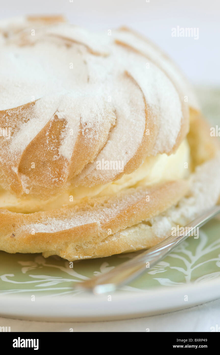 Puff cake with cream and covered with sugar Stock Photo - Alamy