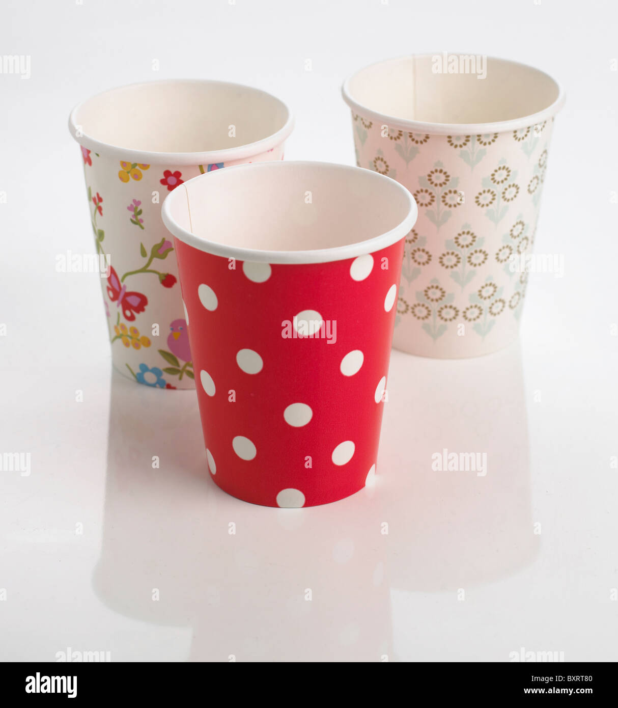 Three brightly coloured disposable paper cups Stock Photo - Alamy