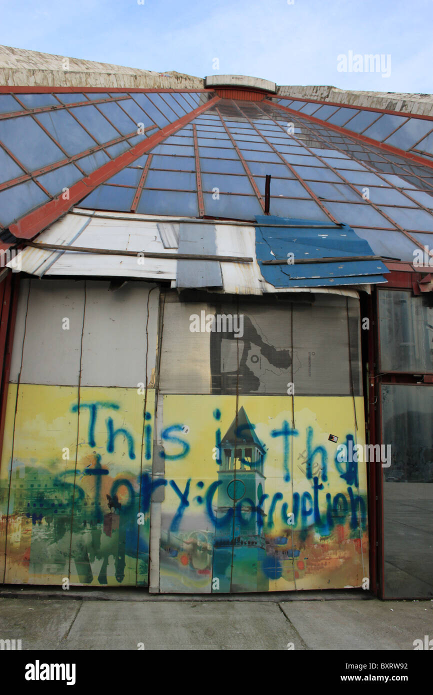 This is the story of corruption. Graffiti on a ruined shopping centre ...