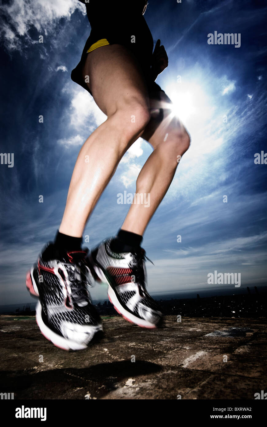 men jumping with hard backlight Stock Photo - Alamy