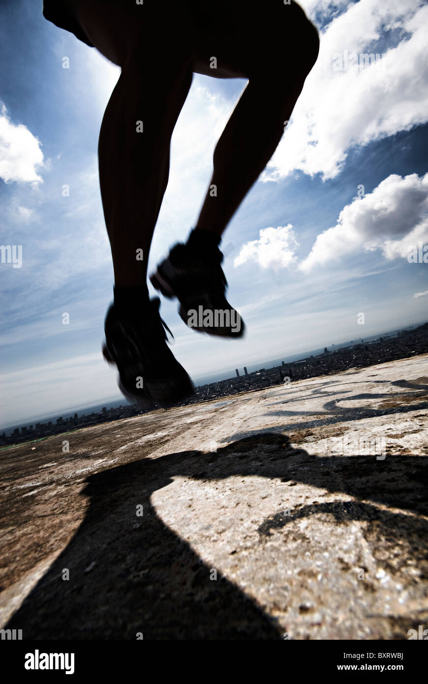 men jumping with hard backlight Stock Photo - Alamy