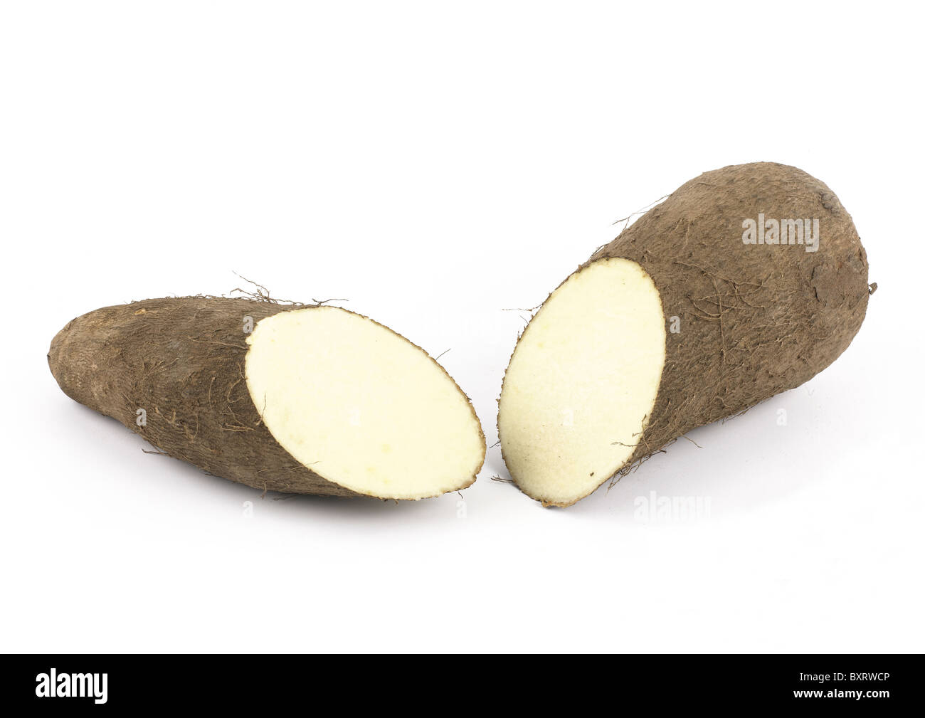Yam cut into half on white background Stock Photo - Alamy