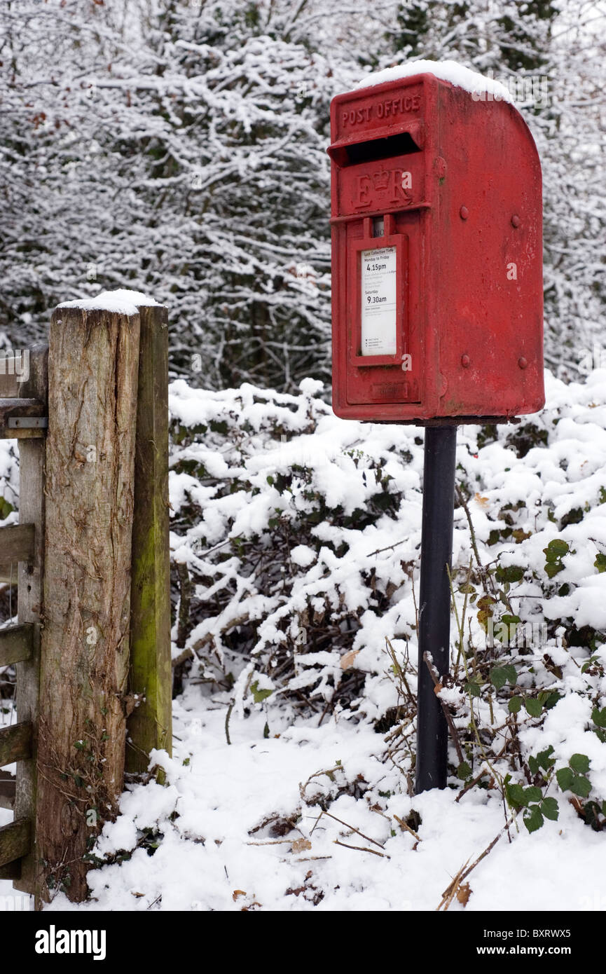 traditional red rural post box covered in snow Stock Photo - Alamy