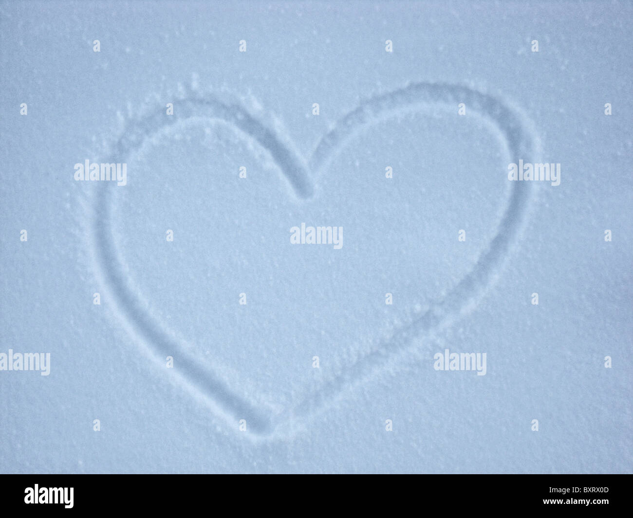 Snow background with heart shape Stock Photo - Alamy