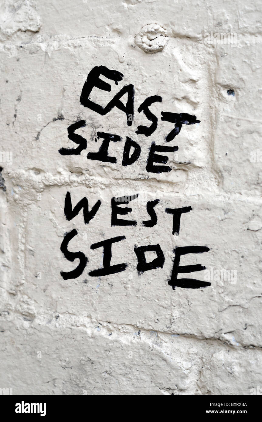 Graffiti On A Wall West Side And East Side Stock Photo - Alamy