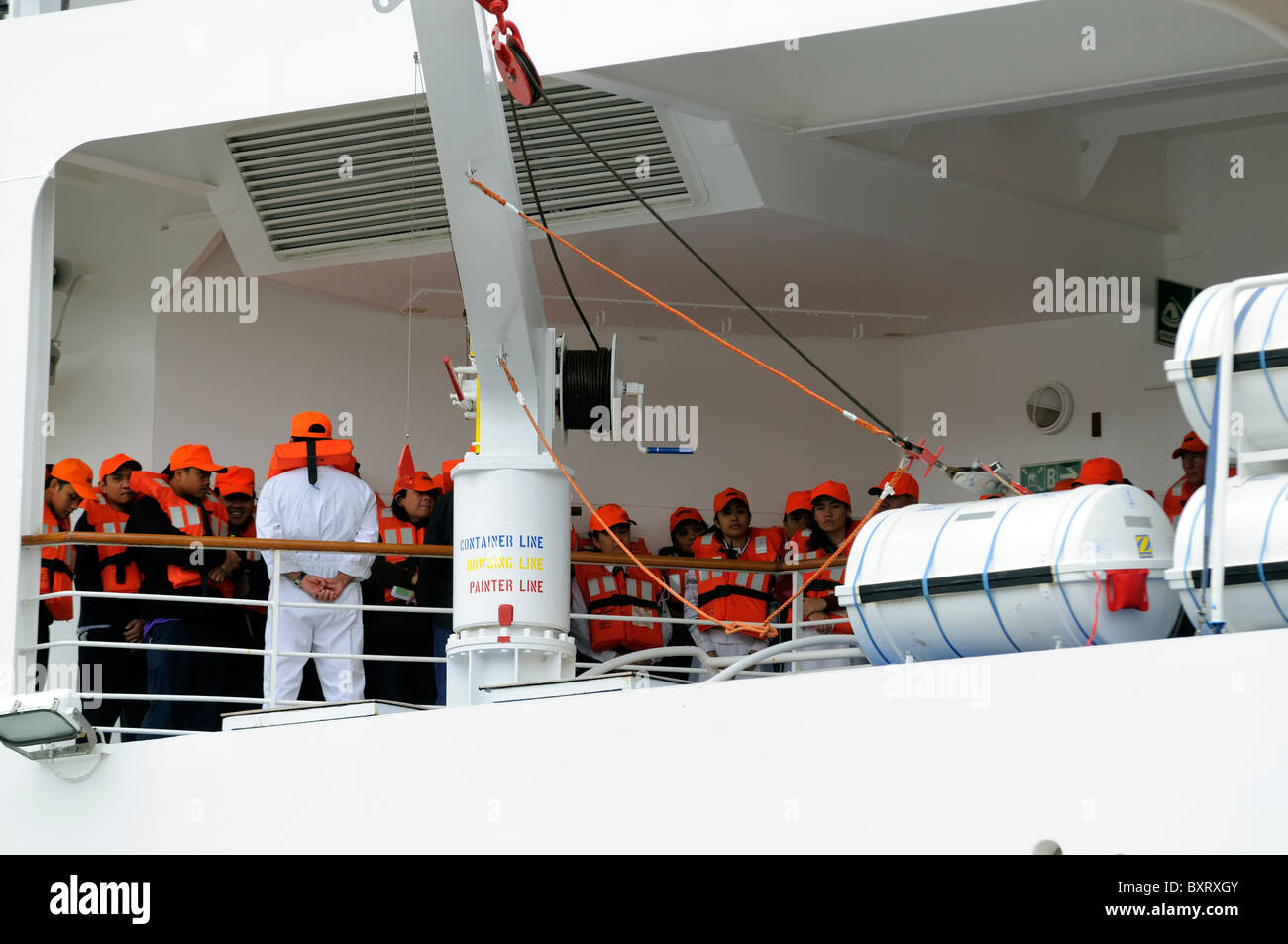 Crew Of A Cruise Ship Practice Lifeboat Drill Stock Photo - Alamy