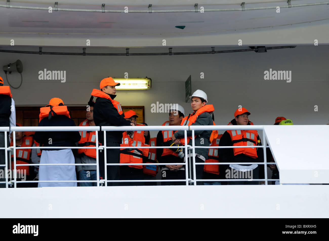 Lifeboat Drill For The Crew Of A Cruise Ship Stock Photo - Alamy