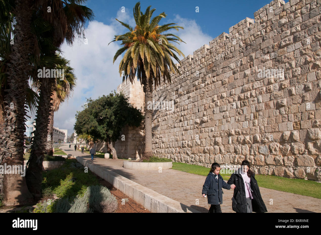 two young Jewish orthodox children walking by city walls. Jerusalem Old ...
