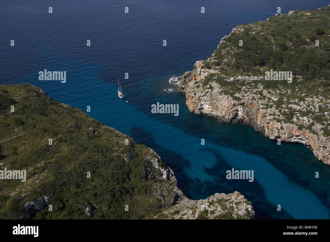 Cala Coves with boat, Menorca, Balearics Stock Photo - Alamy