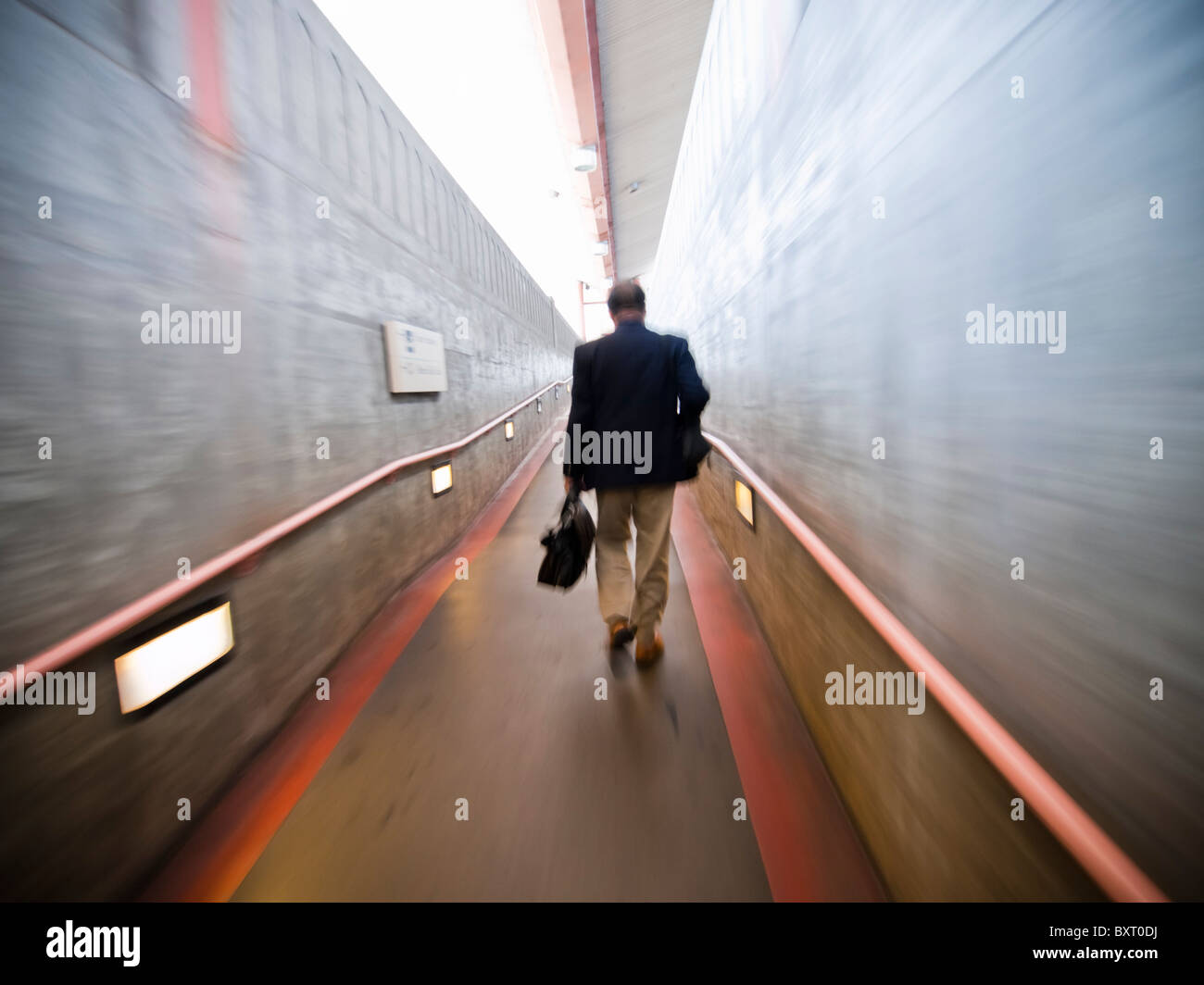 Businessman running for a train Stock Photo - Alamy