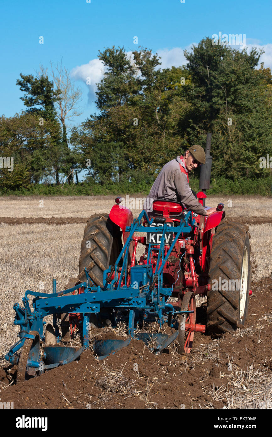 Farmer using a Tractor to plough a field in a ploughing match, UK Stock ...