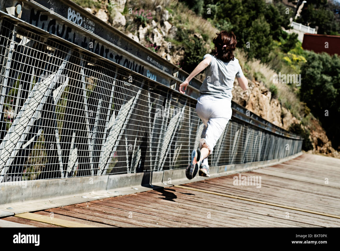 Girl running through park hi-res stock photography and images - Alamy