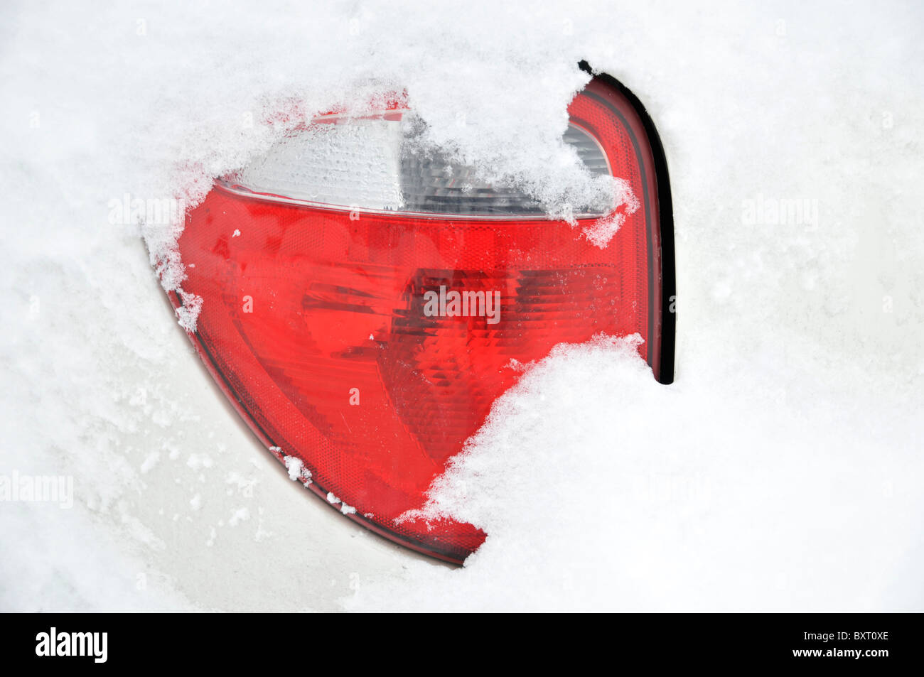 Back red light of car in snow Stock Photo - Alamy