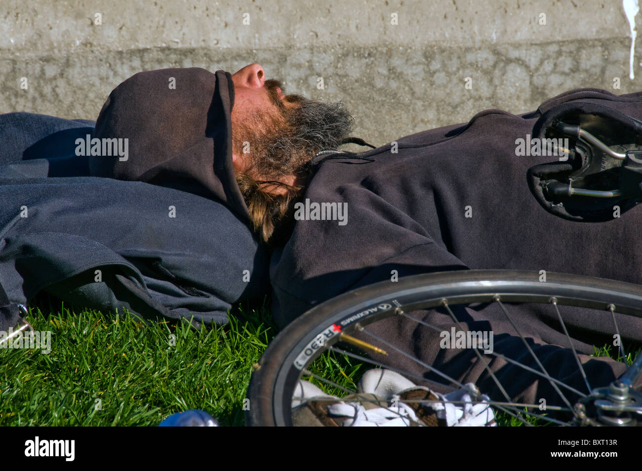Homeless man sleeping in city park in San Francisco CA USA California ...