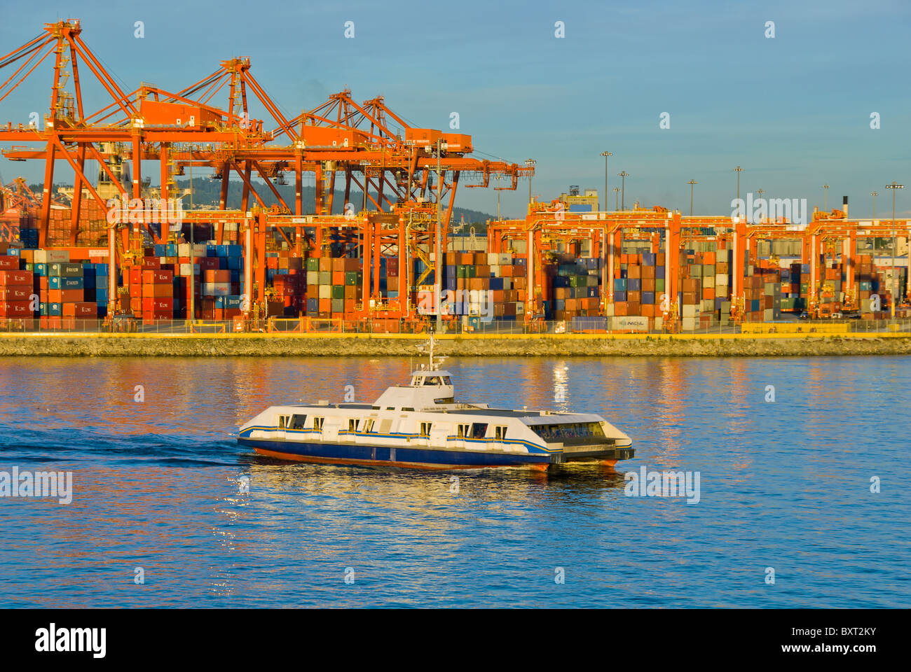 "SeaBus" passenger only ferry passing loading cranes in Port of ...