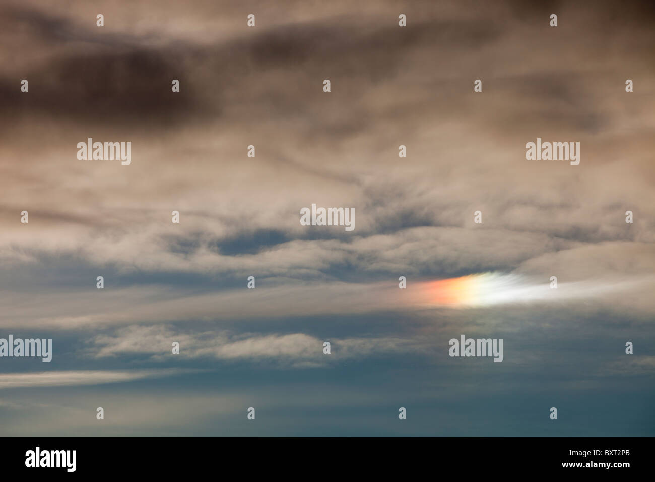 Sun dog or parhelion caused by the sun reflecting off ice crystals in ...