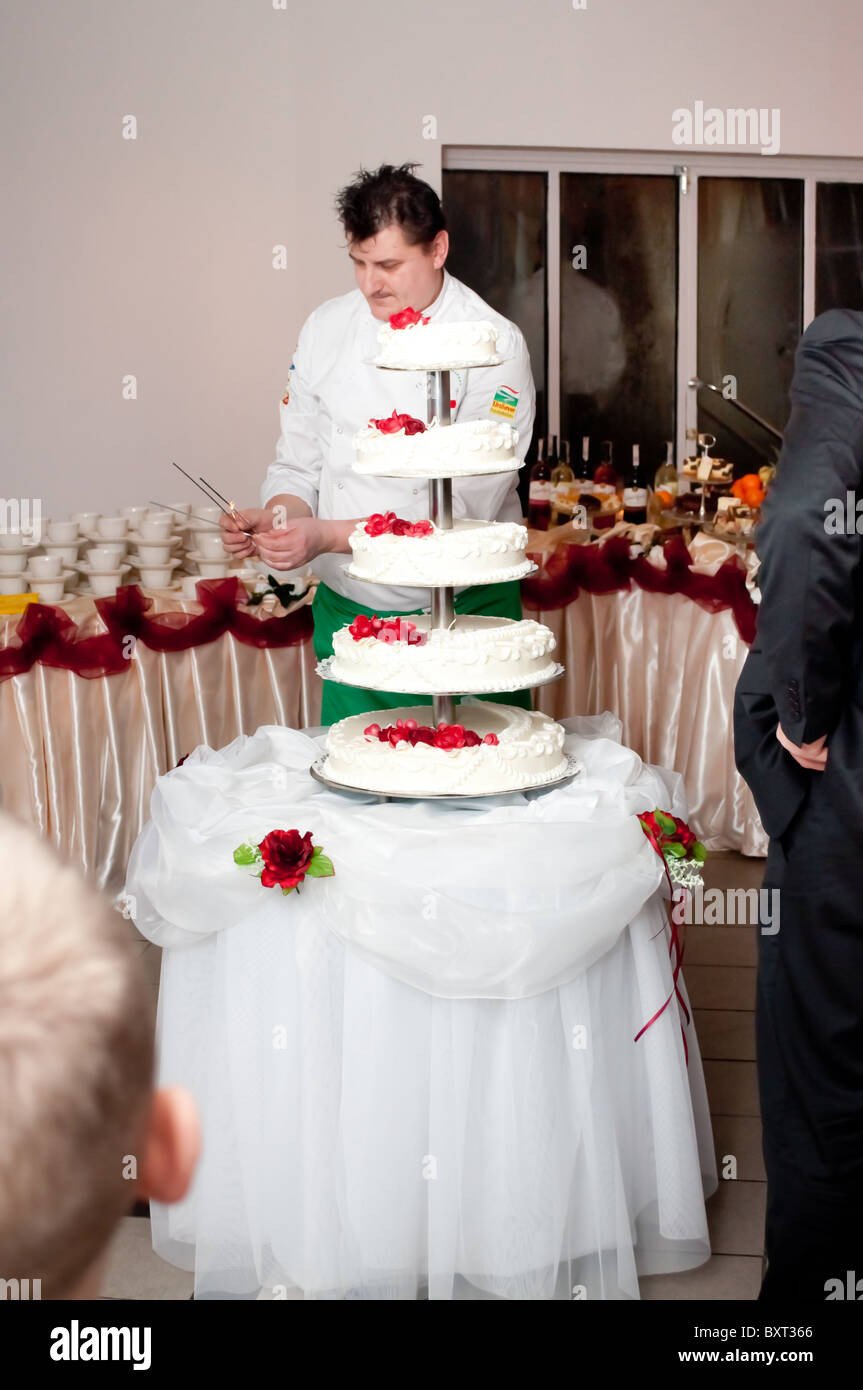 cook and wedding cream cake Stock Photo - Alamy